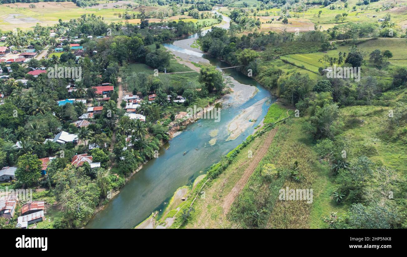 Beautiful shot of The Pulangi River and a small town in Mindanao Stock ...