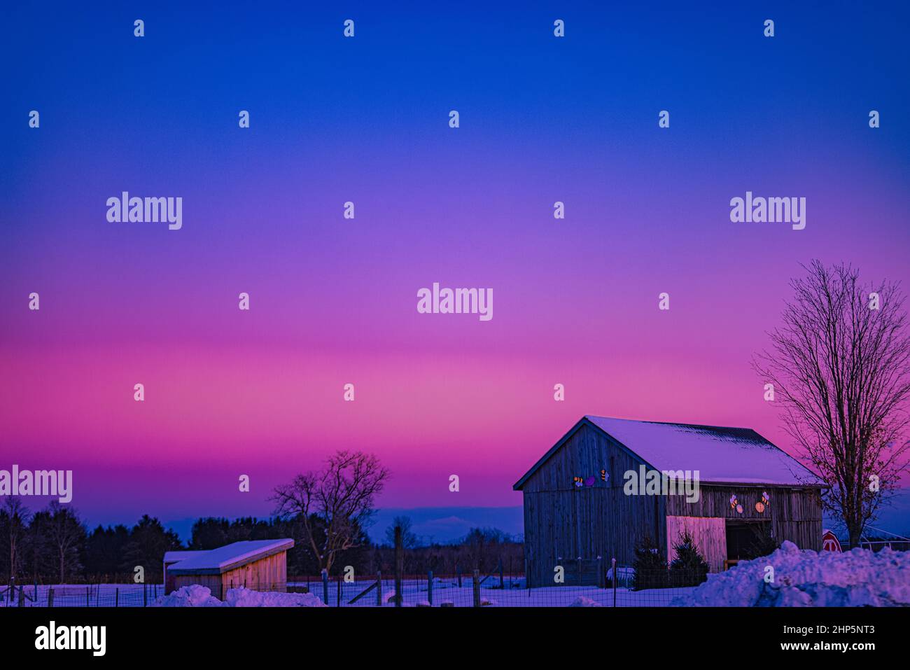 A wooden house on sunset sky background Stock Photo - Alamy