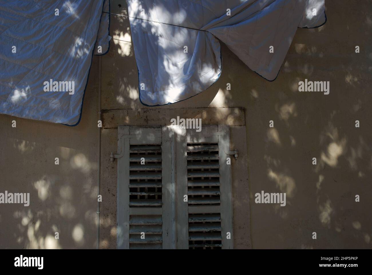 Sheets hanging on washing line from a window, Perast, Montenegro Stock ...