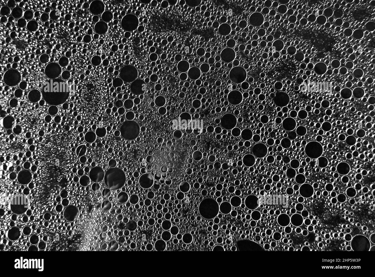 Black background oil bubble drop Black and White Stock Photos & Images ...