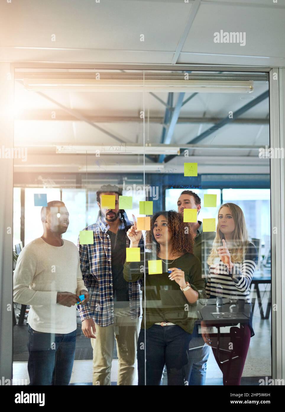Harnessing the mind power of a team. Shot of colleagues having a ...