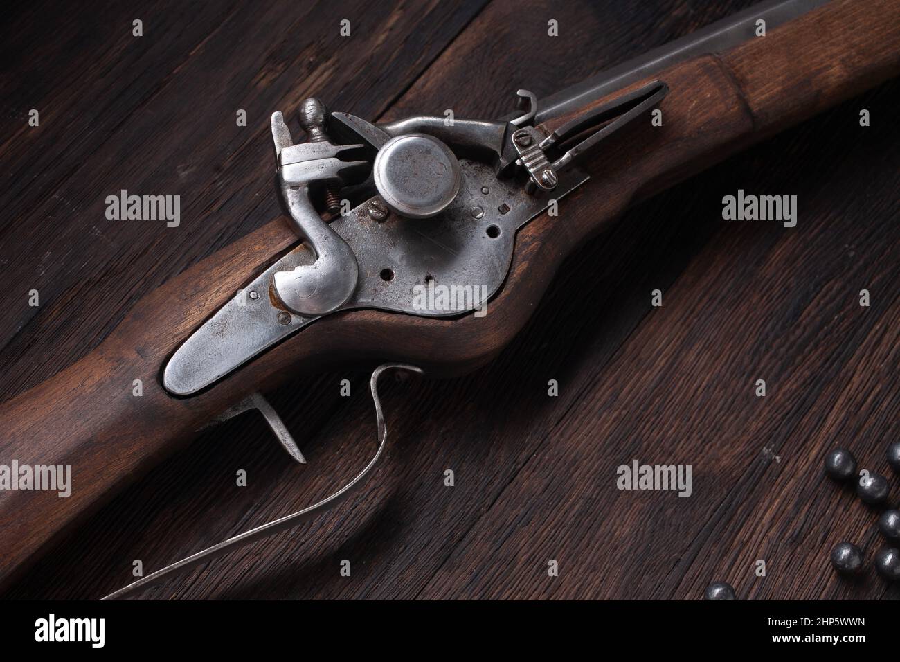 17th century ancient flintlock musket with powder flask and led bullets ...