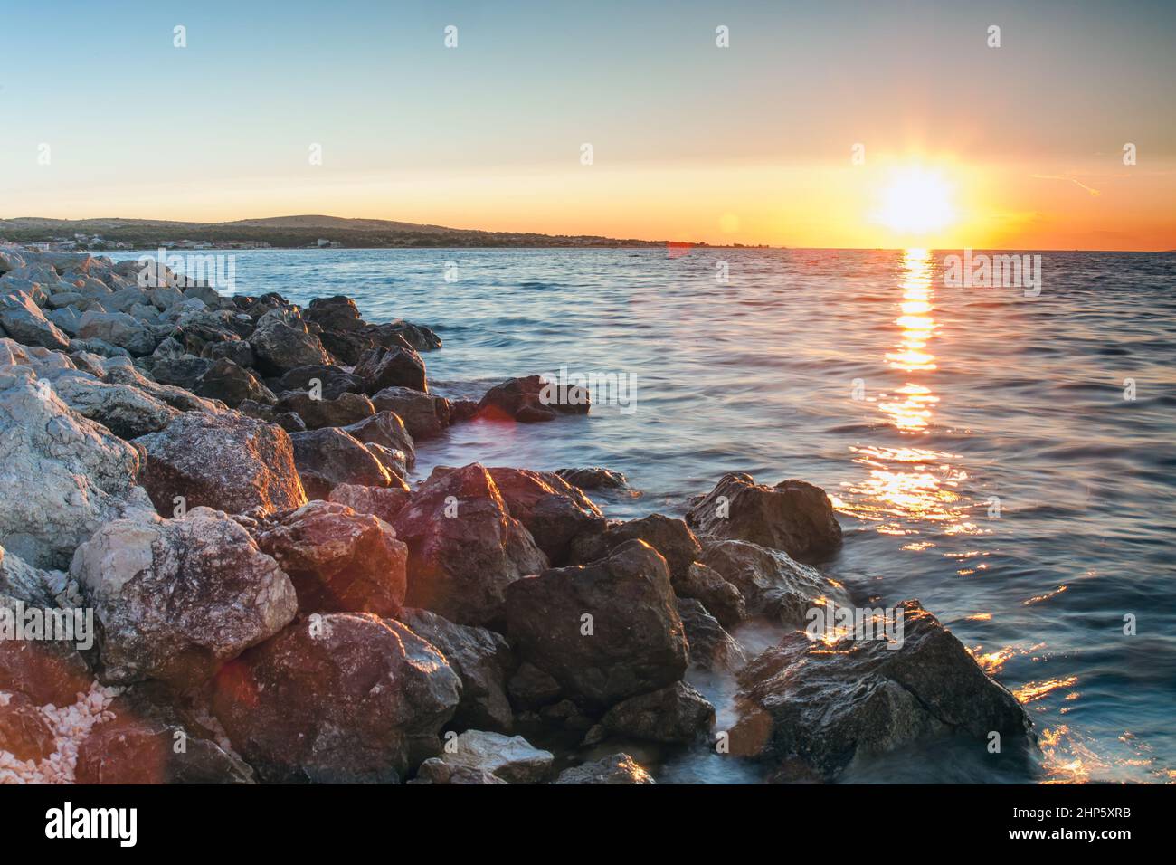Rocky coastline and blue sky on island Vir, Croatia. Evening sunset ...