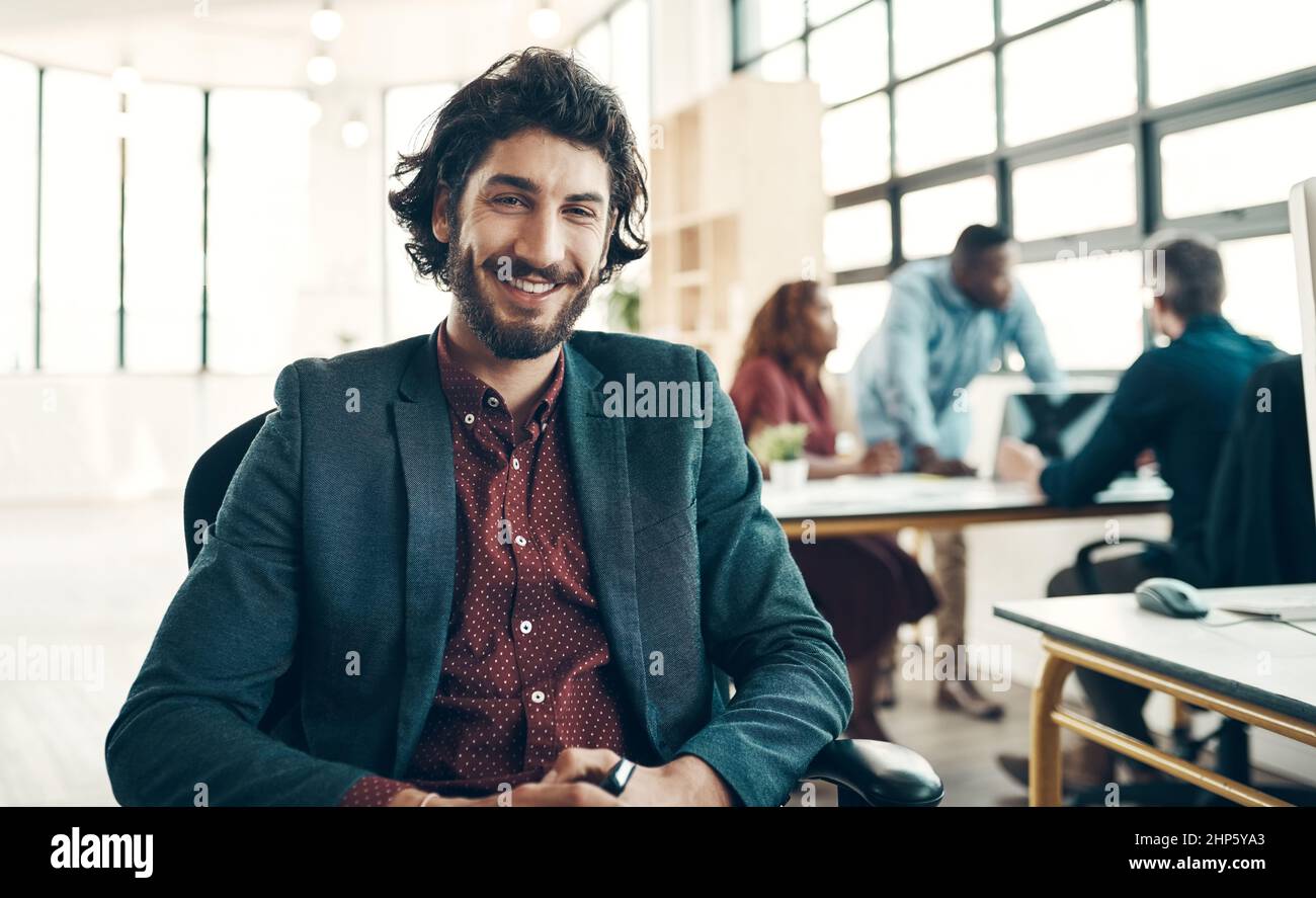 Greet every workday with a positive attitude. Portrait of a young ...