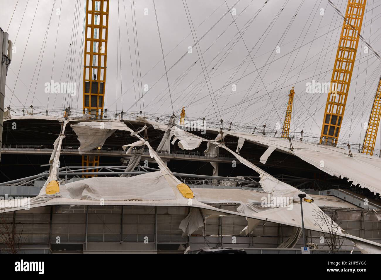London, UK. 18th Feb, 2022. Storm Eunice left a giant hole in the O2 ...