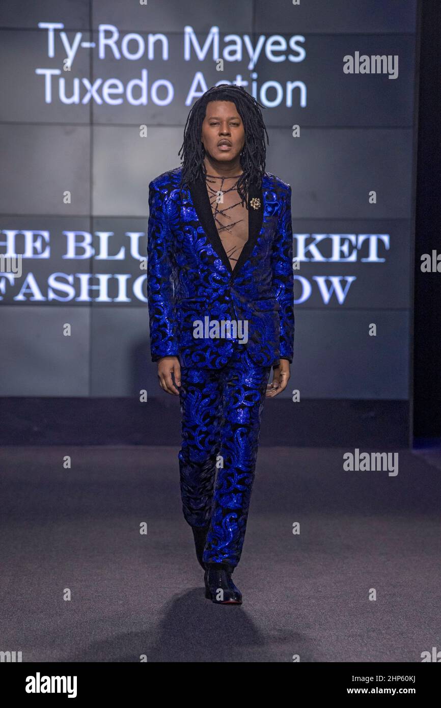 Ty-Ron Mayes walks the runway wearing Tuxedo Action during the Sixth ...