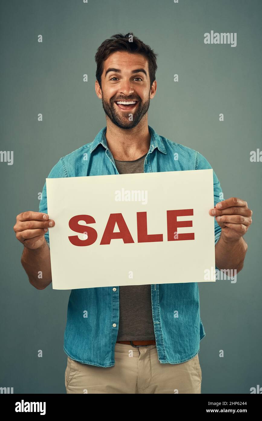 Have you heard about the big sale. Studio portrait of a handsome young ...