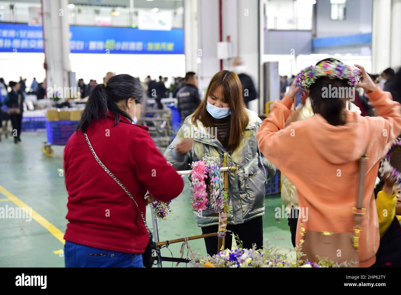 KUNMING, CHINA - FEBRUARY 17, 2022 - Merchants sell flowers at the ...