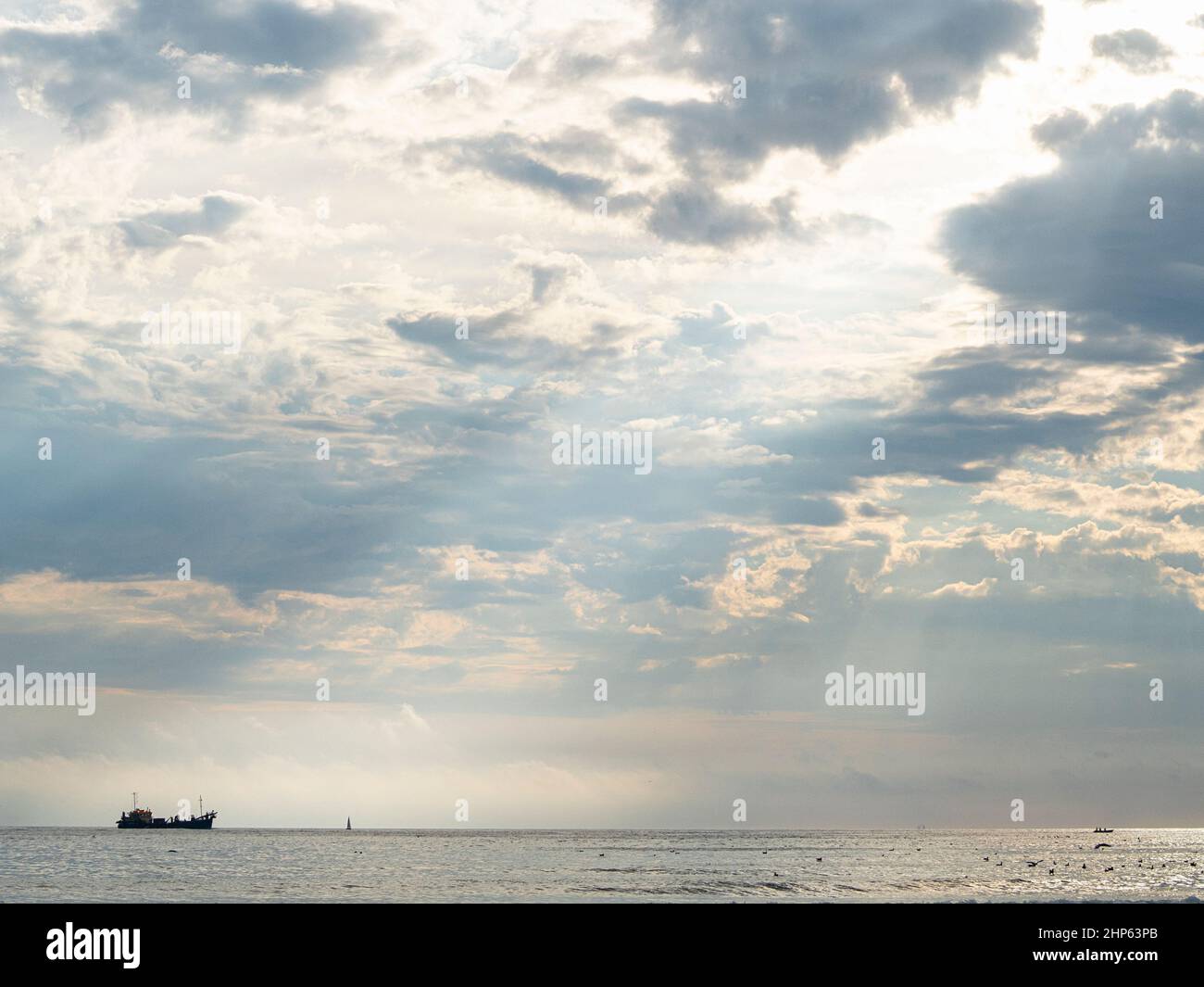 Fishing boat returning harbour sunset hi-res stock photography and ...