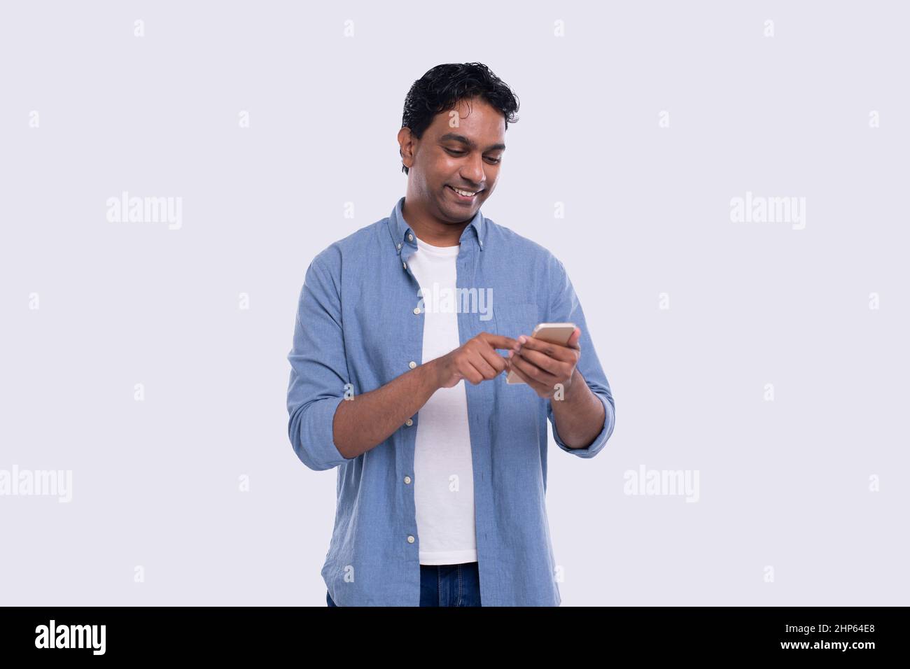 Indian man texting hi-res stock photography and images - Alamy