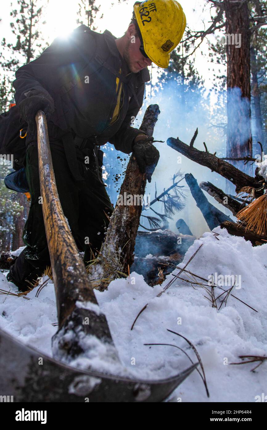 Verdi, Nevada, USA. 15th Feb, 2022. Dylan Todd moves wood on a burn ...