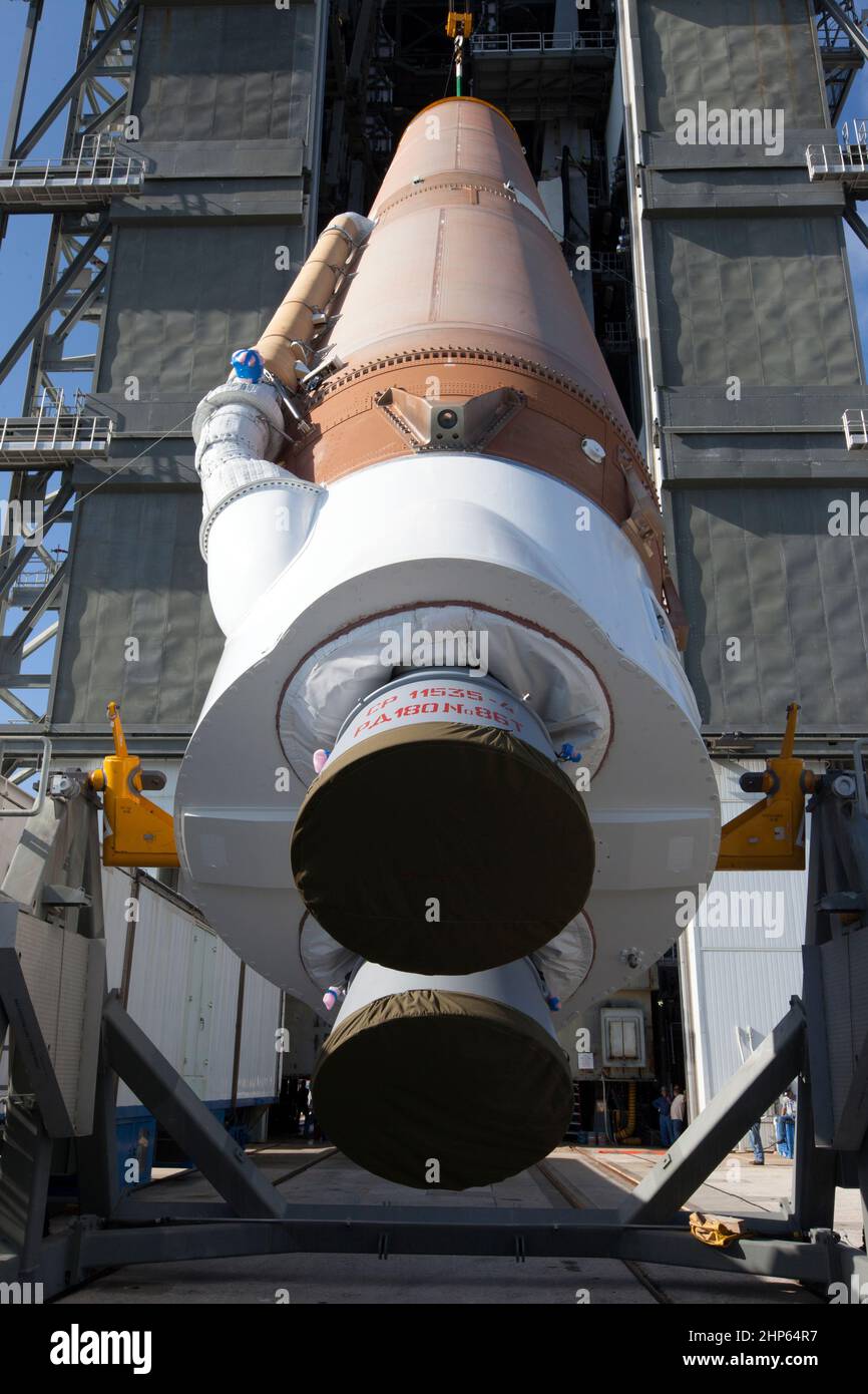 A United Launch Alliance Atlas V first stage is lifted at the Vertical ...