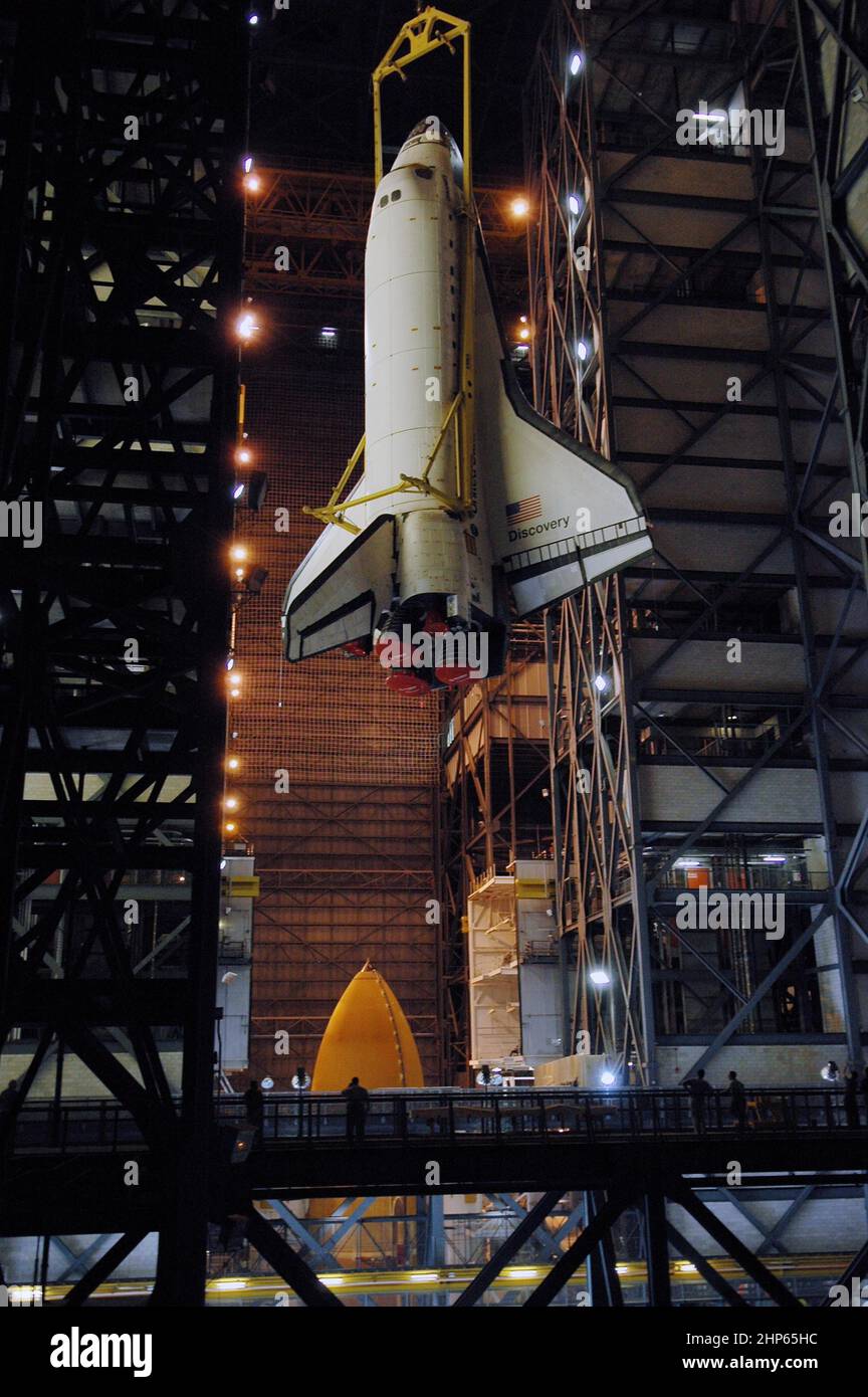 The orbiter Discovery is being lowered into high bay 3 of the Vehicle ...