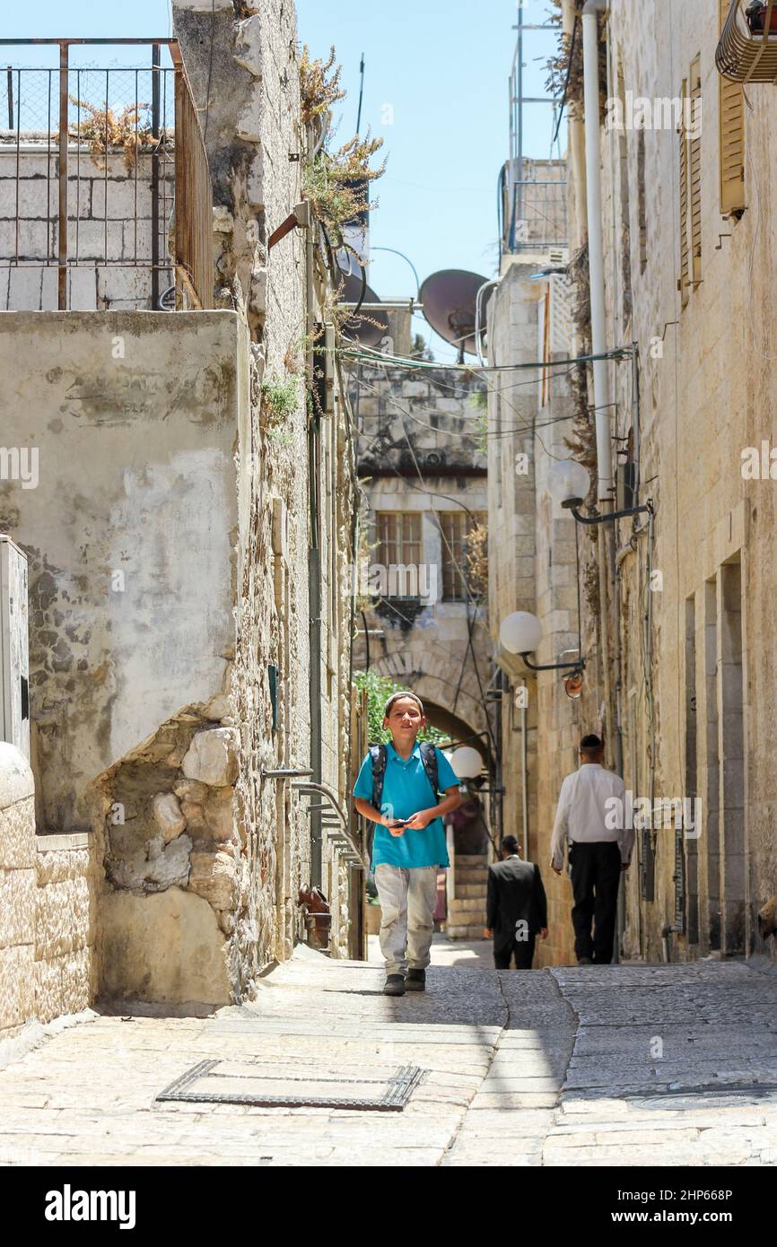 A boy walks in an alley in the old city of Jerusalem, Israel Stock ...