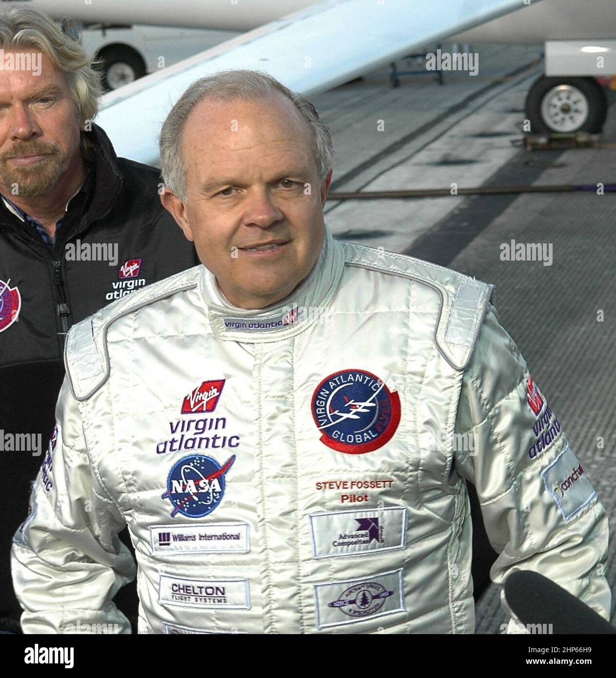 Pilot Steve Fossett talks to the media about the reason the takeoff of ...