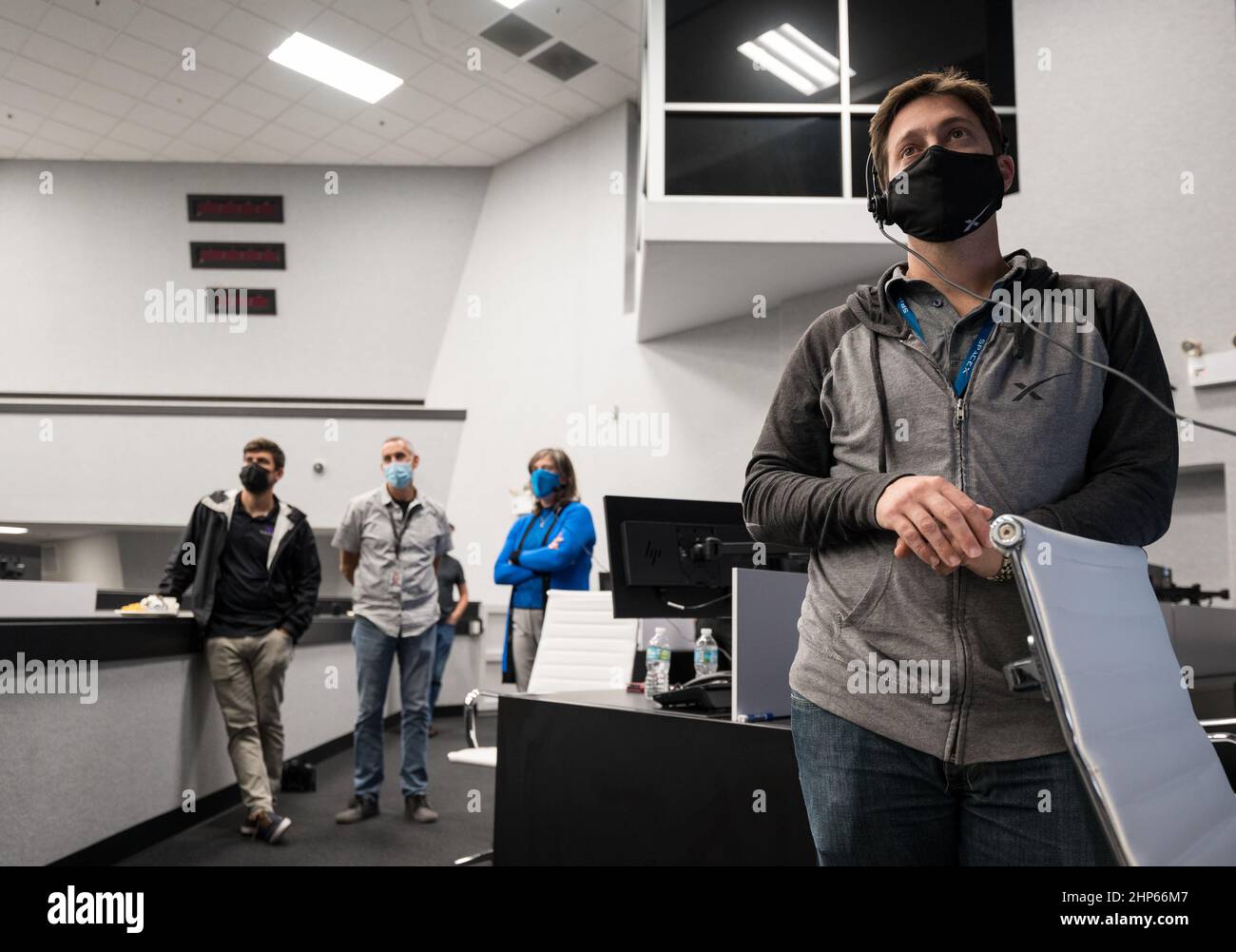NASA and SpaceX officials monitor the countdown during a dress ...