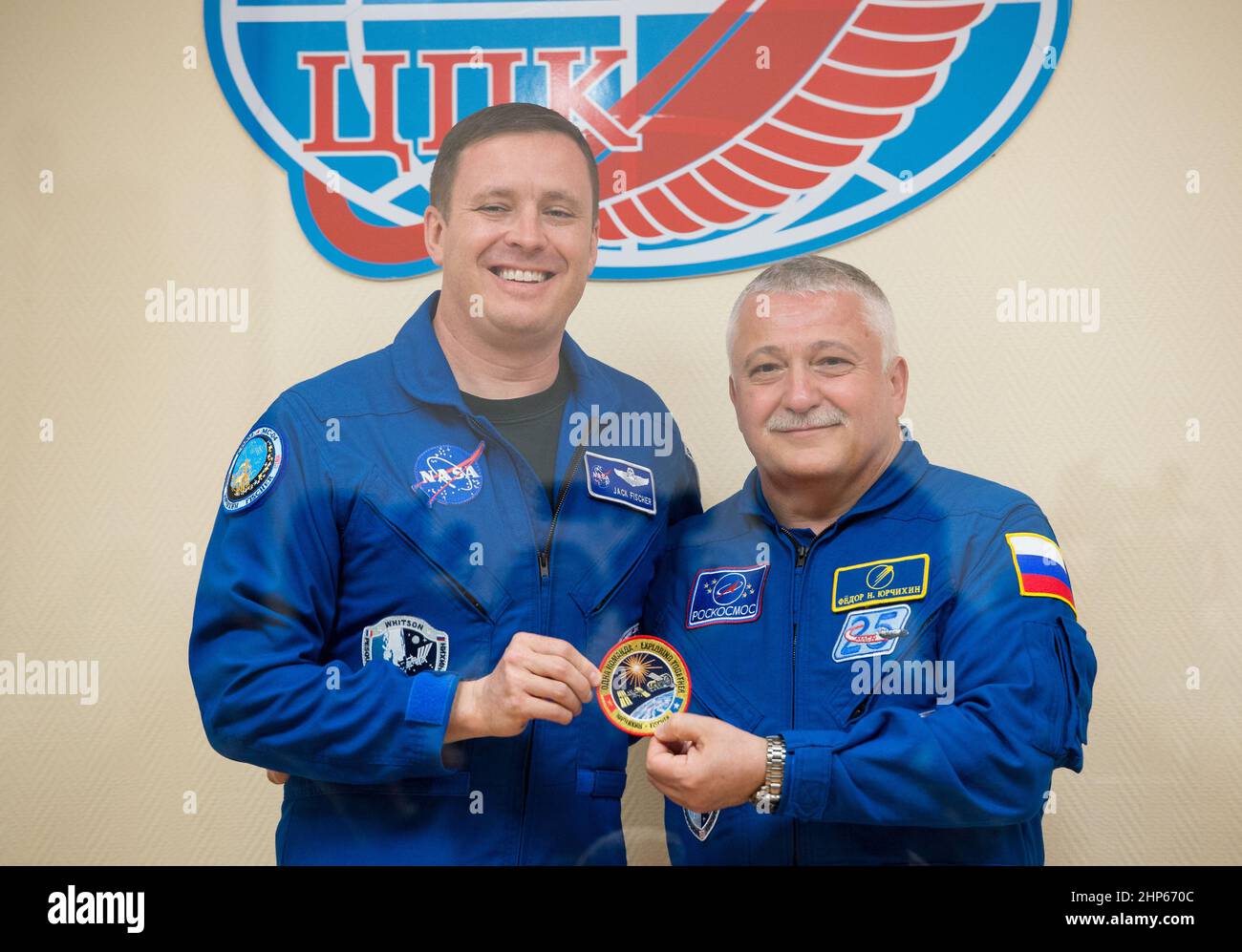 Expedition 51 Flight Engineer Jack Fischer of NASA, left, poses for a ...