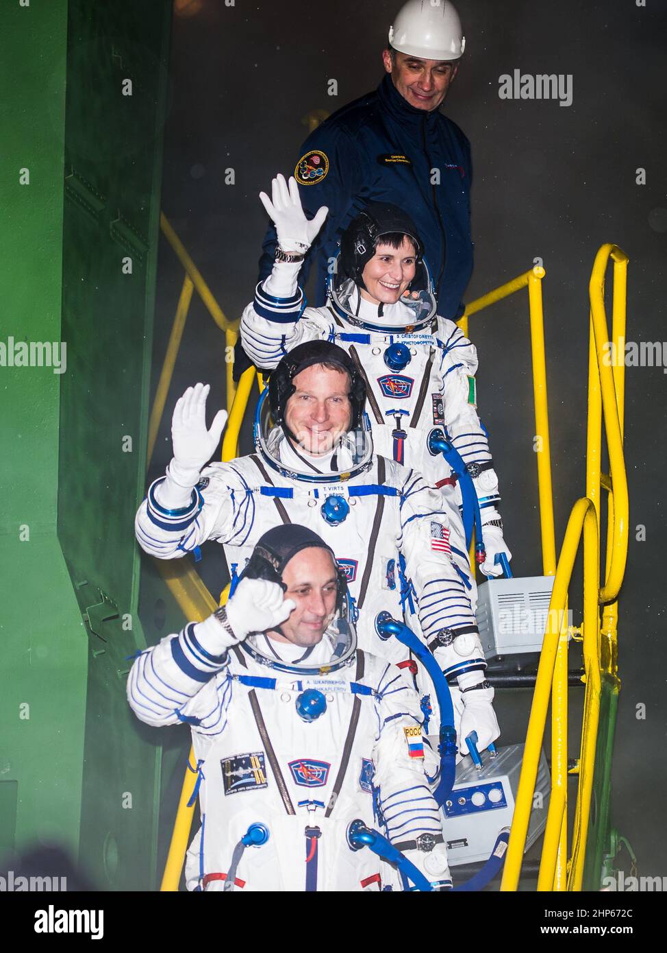 Expedition 42 Flight Engineer Samantha Cristoforetti, of the European Space Agency (ESA), top ...