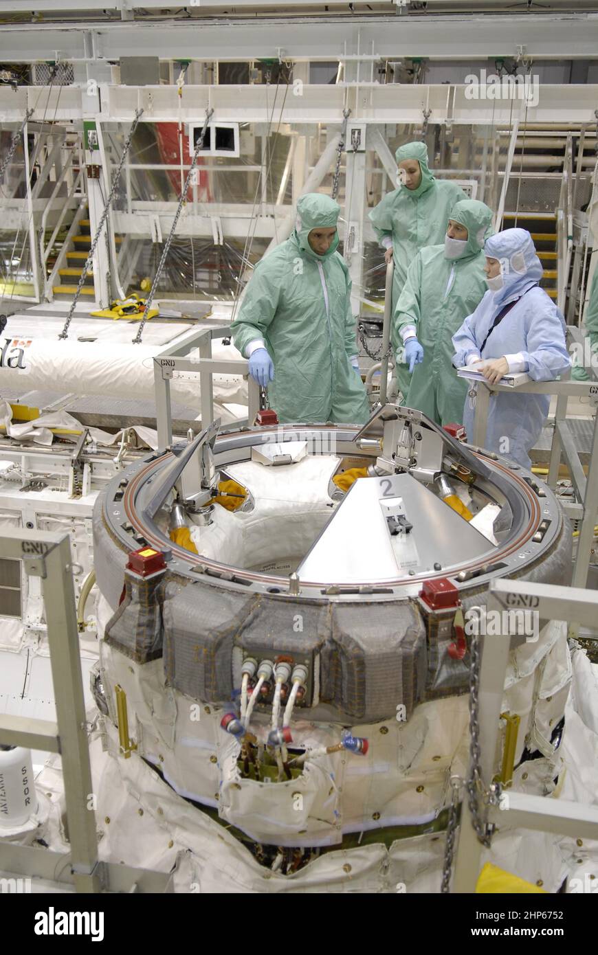 In the Orbiter Processing Facility, STS-117 Pilot Lee Archambault (left) and Mission Specialist ...