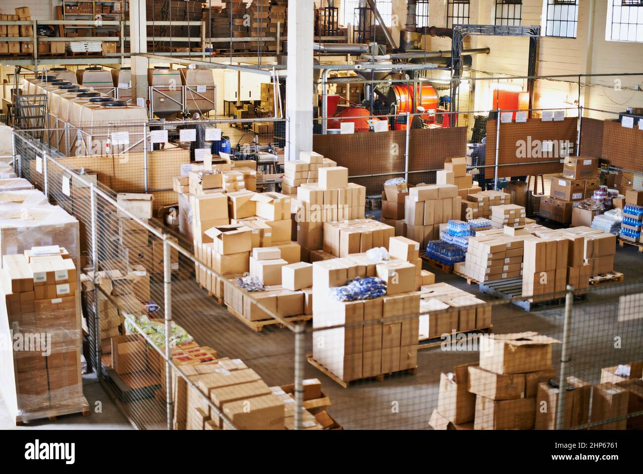 Shipping logistics. Shot of the interior of a large packaging and ...