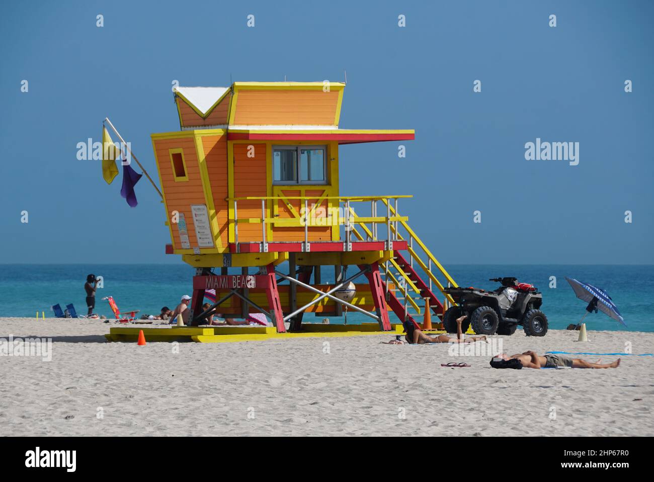 - The bright orange and red color of lifeguard station on the beach ...
