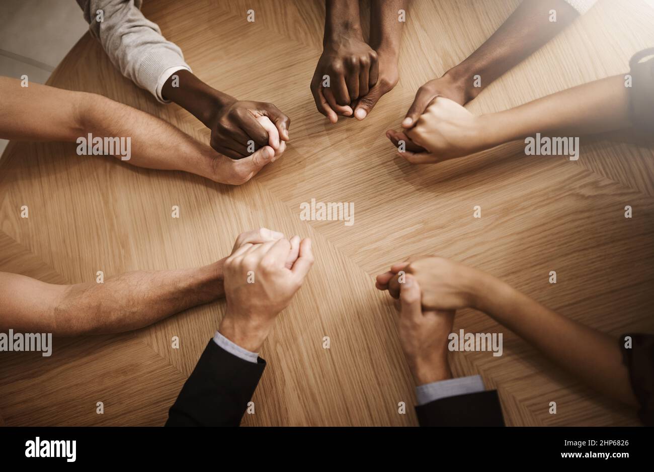 Join hands and make the bond stronger. Cropped shot of a group of ...