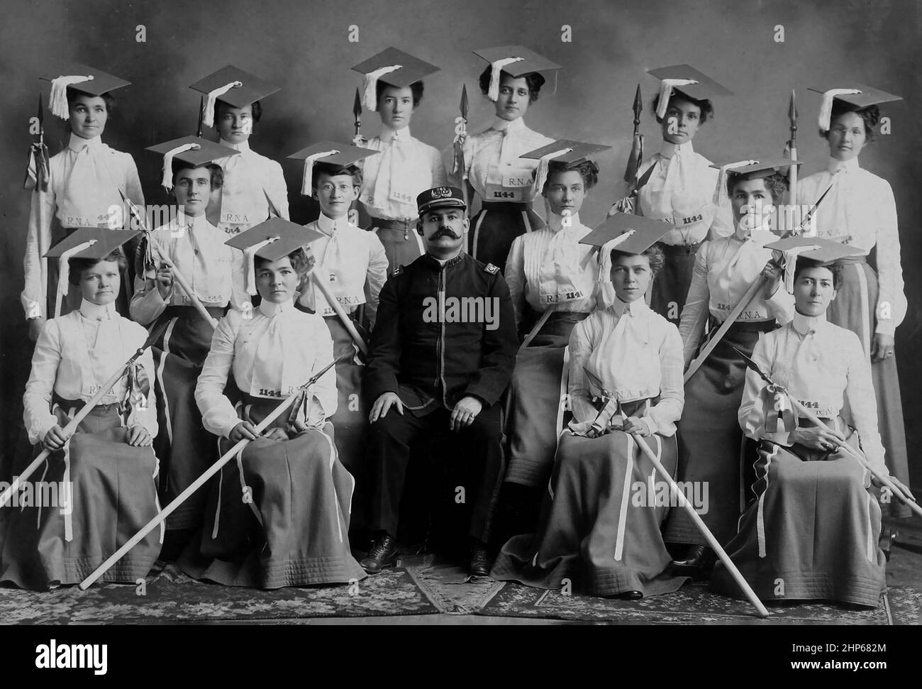 Graduation photo for a group young women with their headmaster, c. 1910 ...
