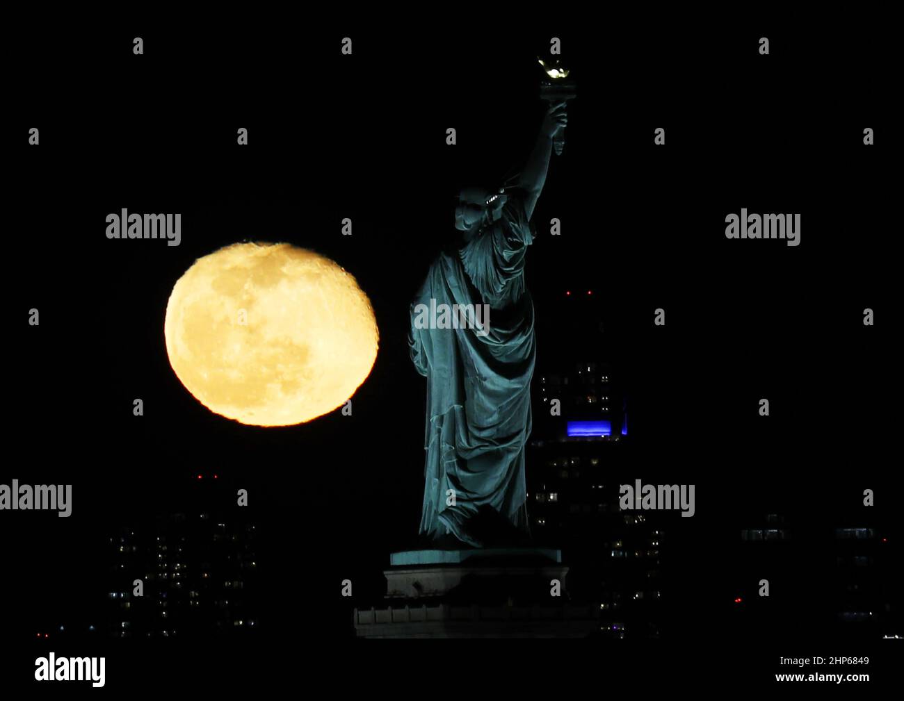 Port Liberte, United States. 18th Feb, 2022. The Moon rises behind the ...