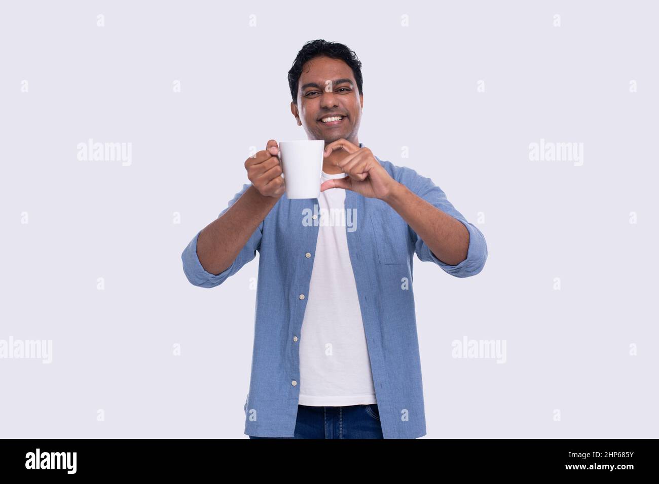 Indian Man Holding Tea Cup Showing Heart Gesture. Love Sign Coffee Cup ...
