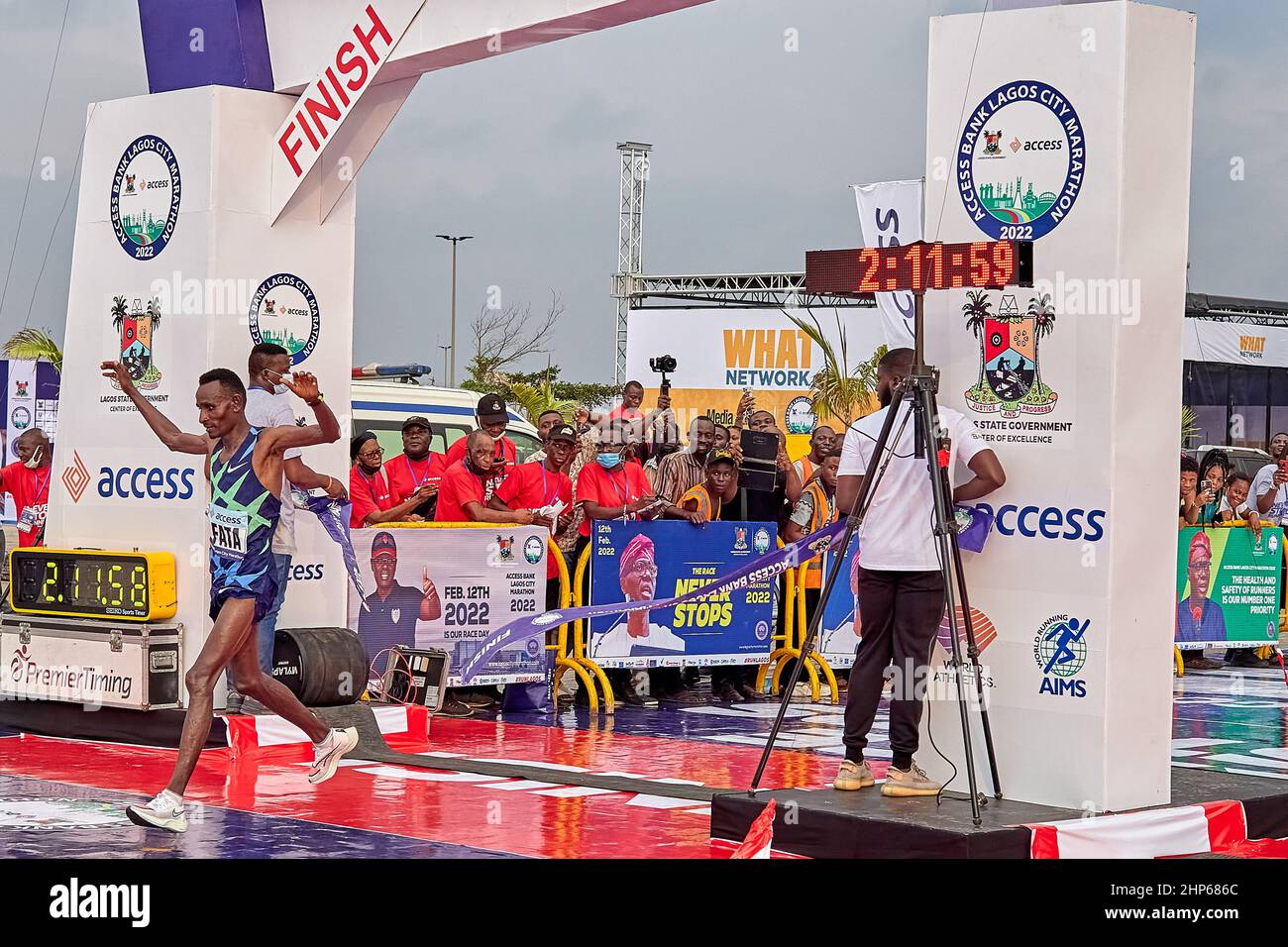 Elite marathon winner, Geleta Ulfata crosses the finish line in the ...