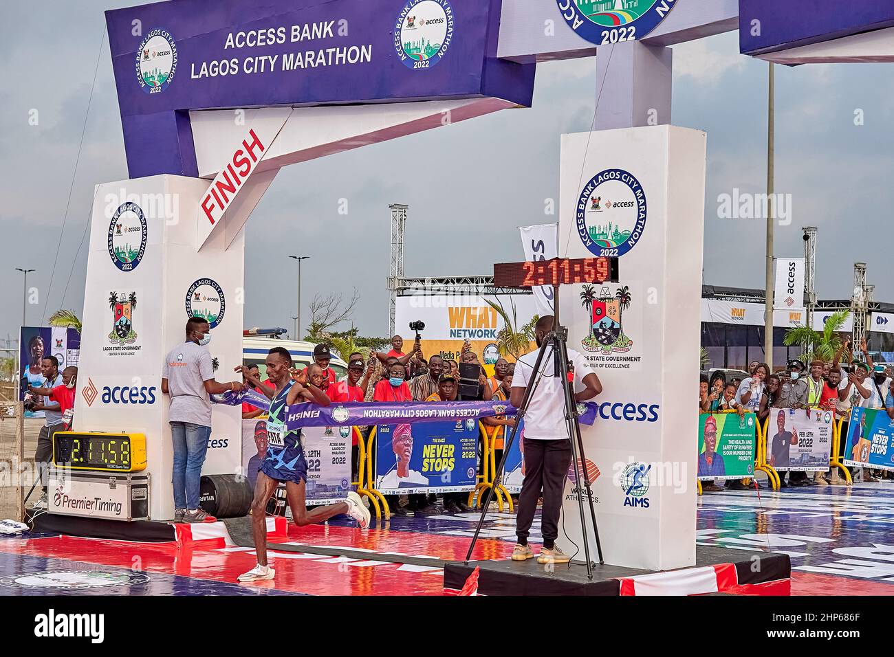 Elite marathon winner, Geleta Ulfata crosses the finish line in the ...