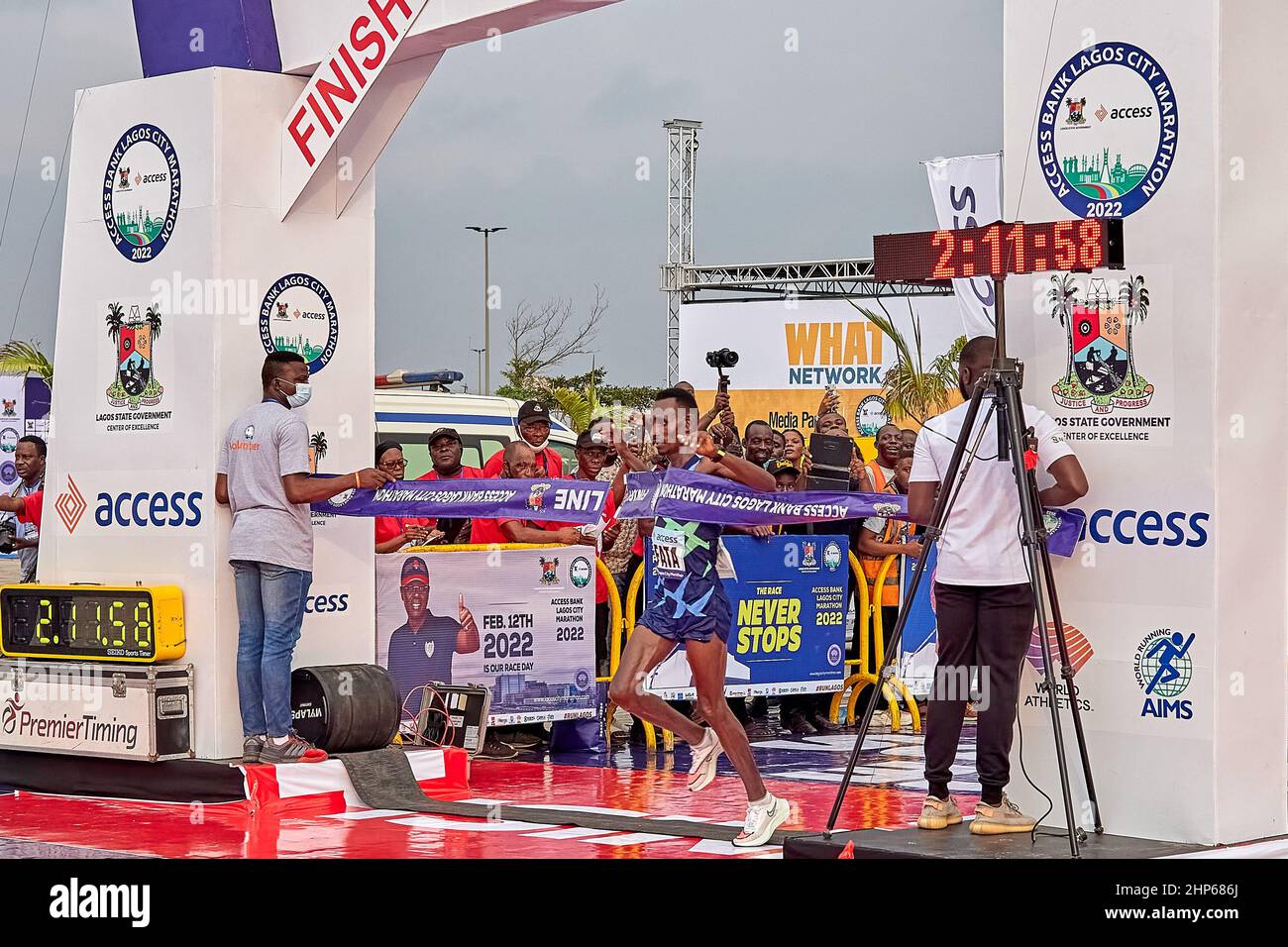 Elite marathon winner, Geleta Ulfata crosses the finish line in the ...