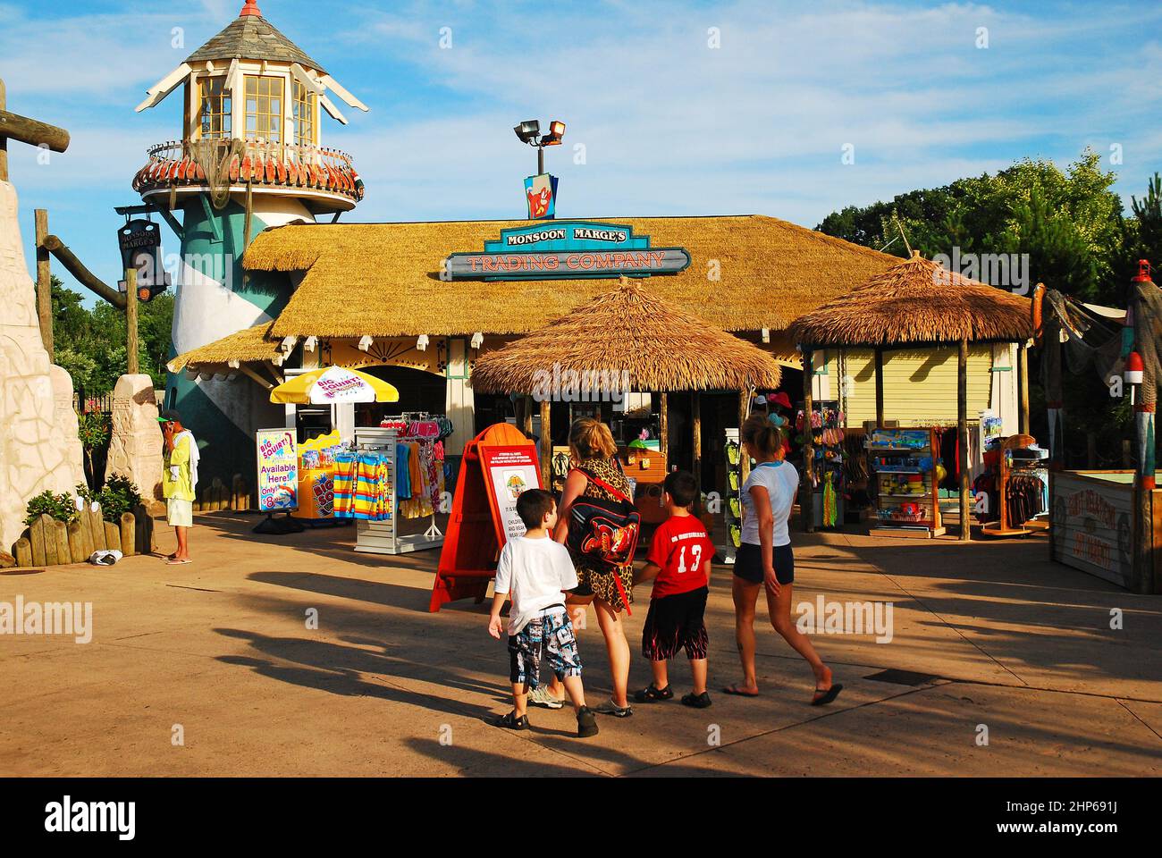 A family shops at a small tiki hut village Stock Photo - Alamy