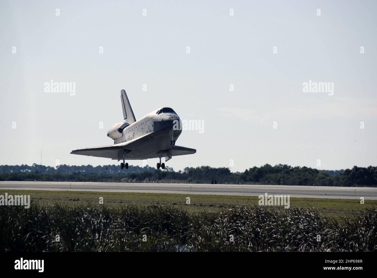 With landing gear down, space shuttle Atlantis approaches landing on ...