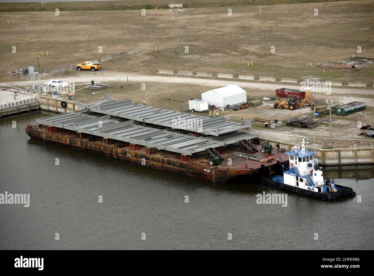 Trestles and girders for a new mobile launcher arrive by barge at the ...