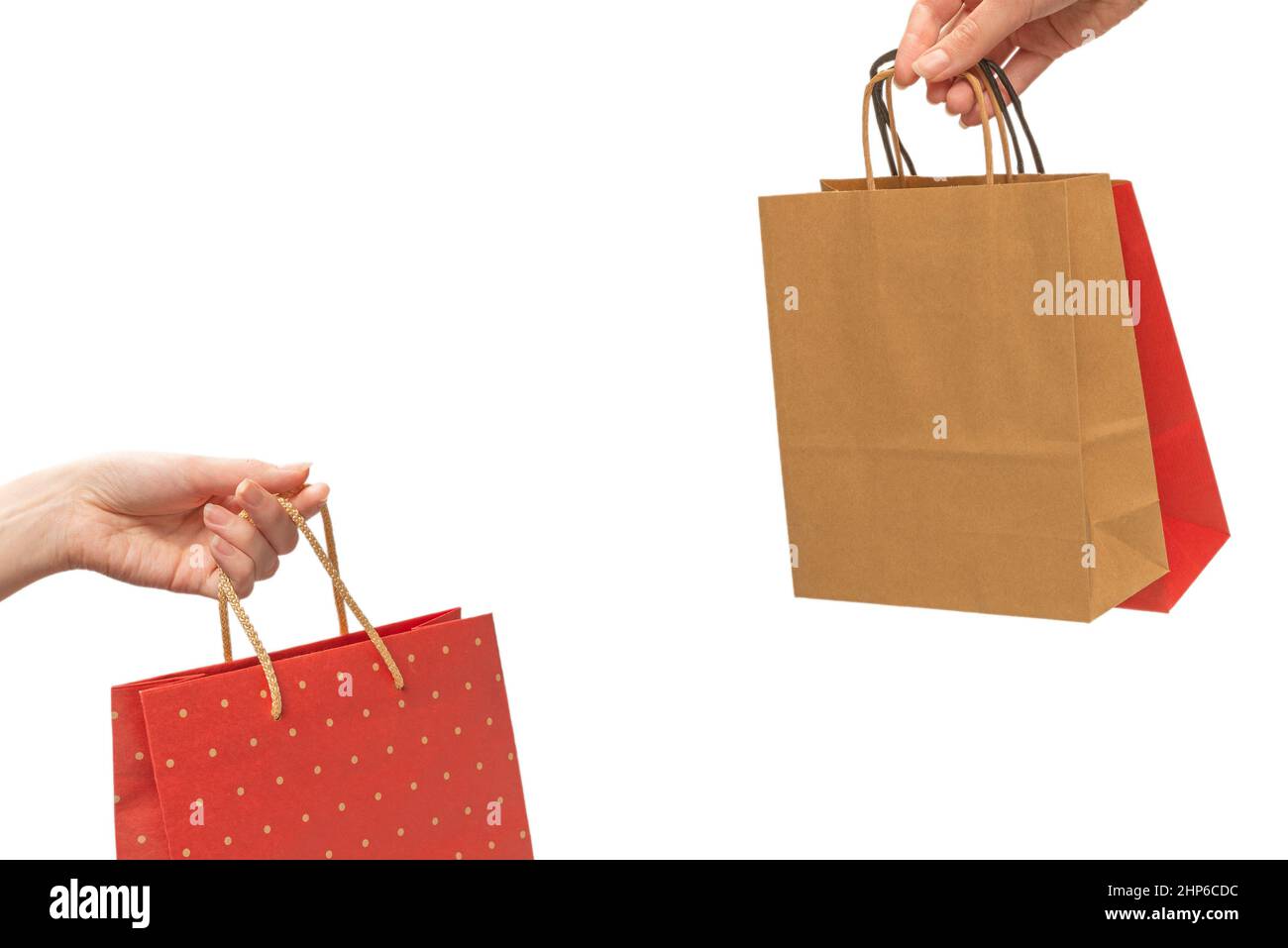 Paper bag in woman hands isolated on white background Stock Photo - Alamy