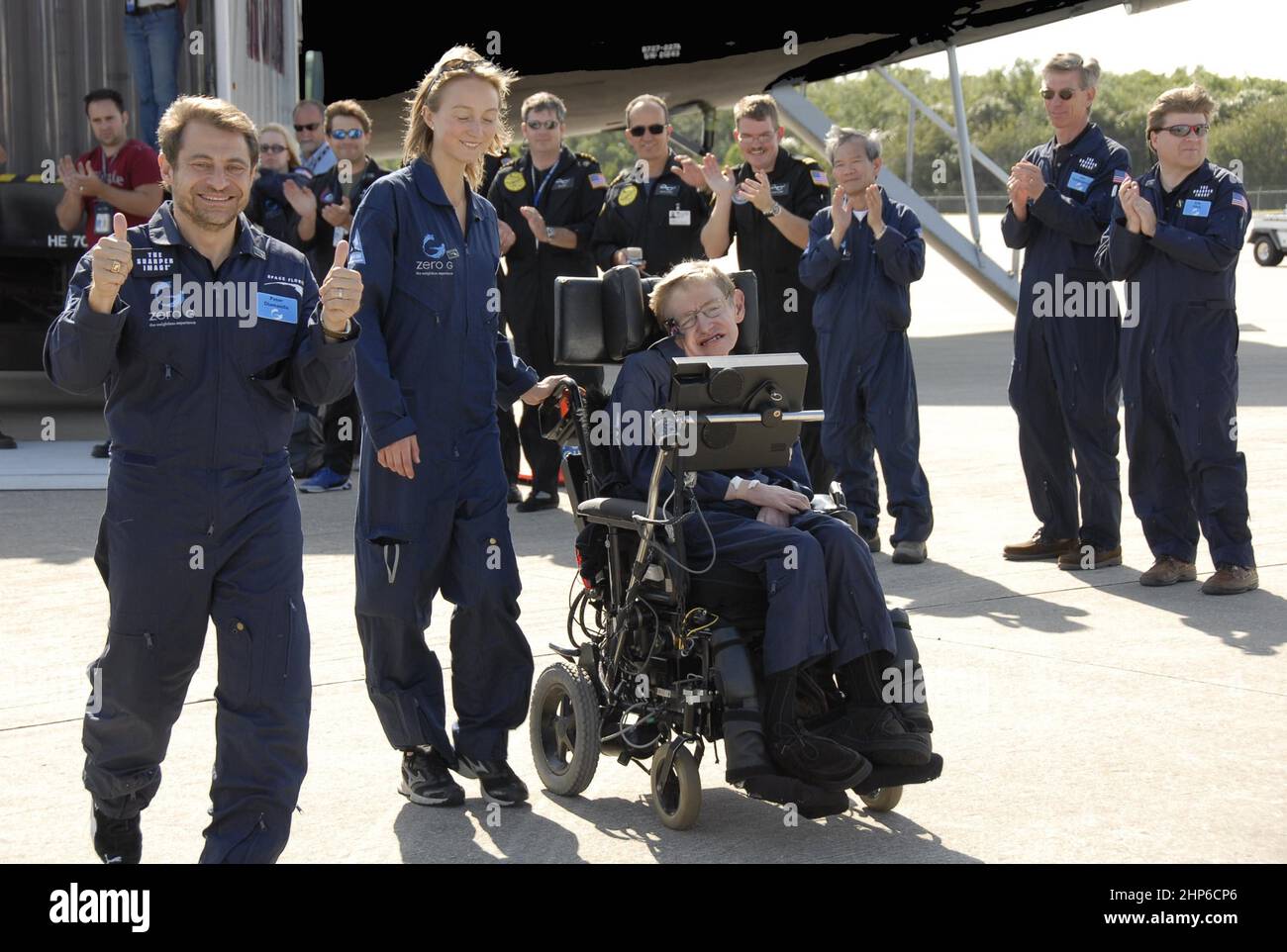 Well-wishers greet noted physicist Stephen Hawking (in the wheelchair ...