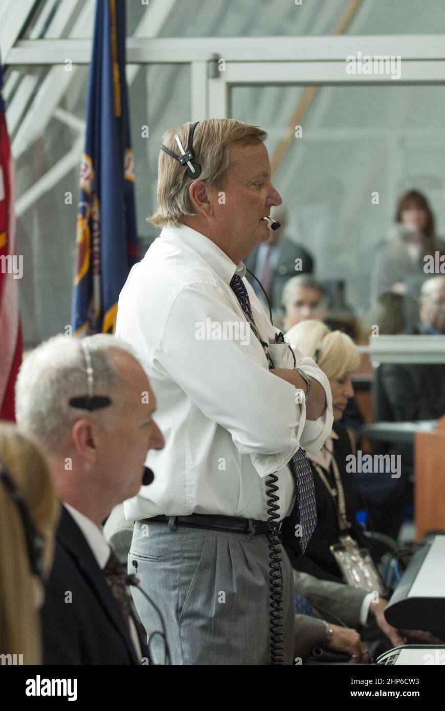 Shuttle Launch Director Mike Leinbach, standing, and his launch team ...