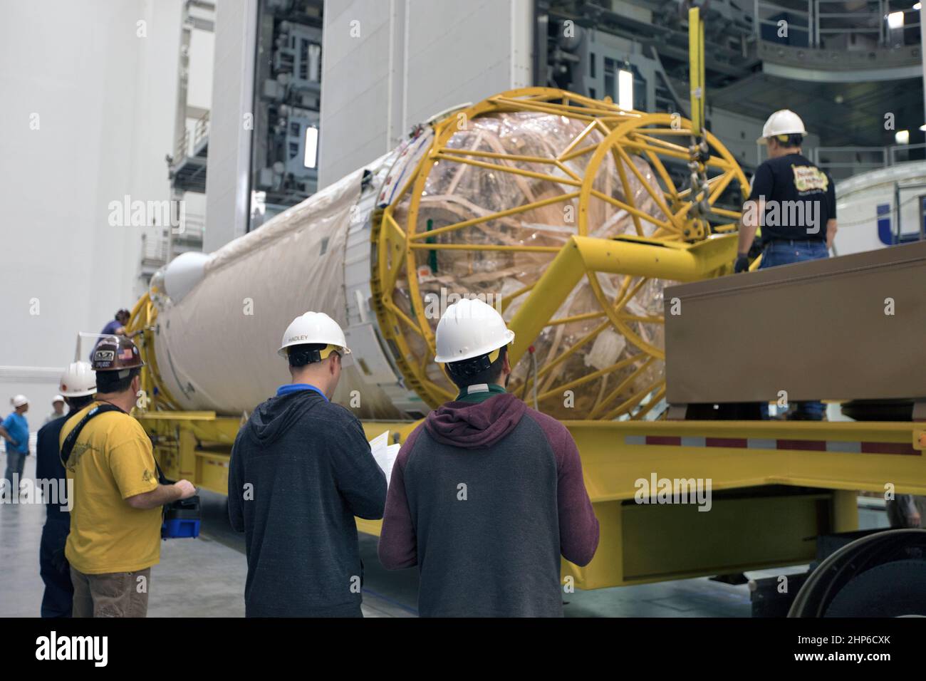 Under the watchful eyes of technicians and engineers, the Centaur upper ...