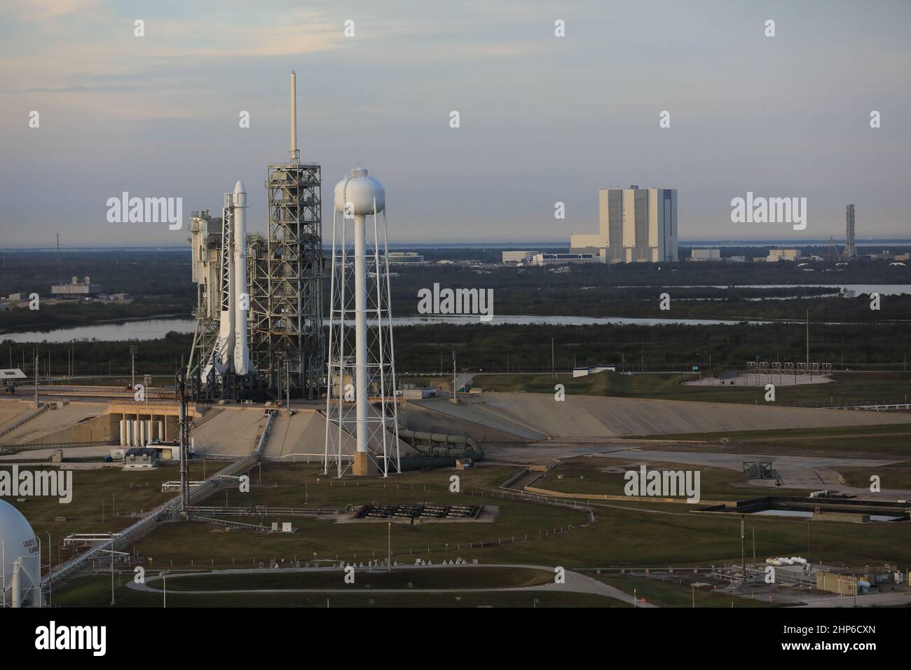 A Falcon 9 rocket stands ready for liftoff at the Kennedy Space Center's Launch Complex 39A. In ...
