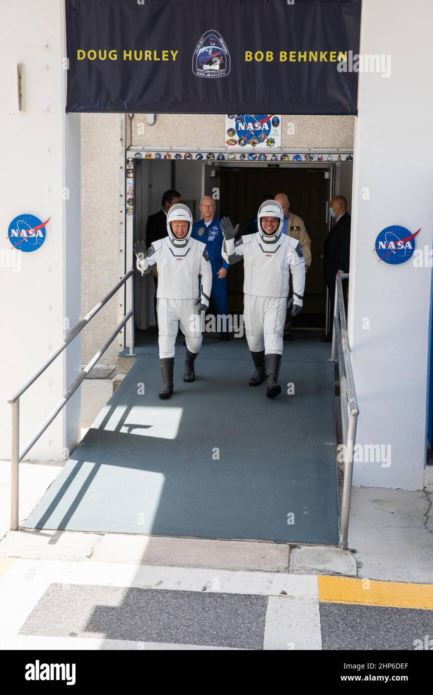 NASA astronauts Douglas Hurley (left) and Robert Behnken wave as they ...