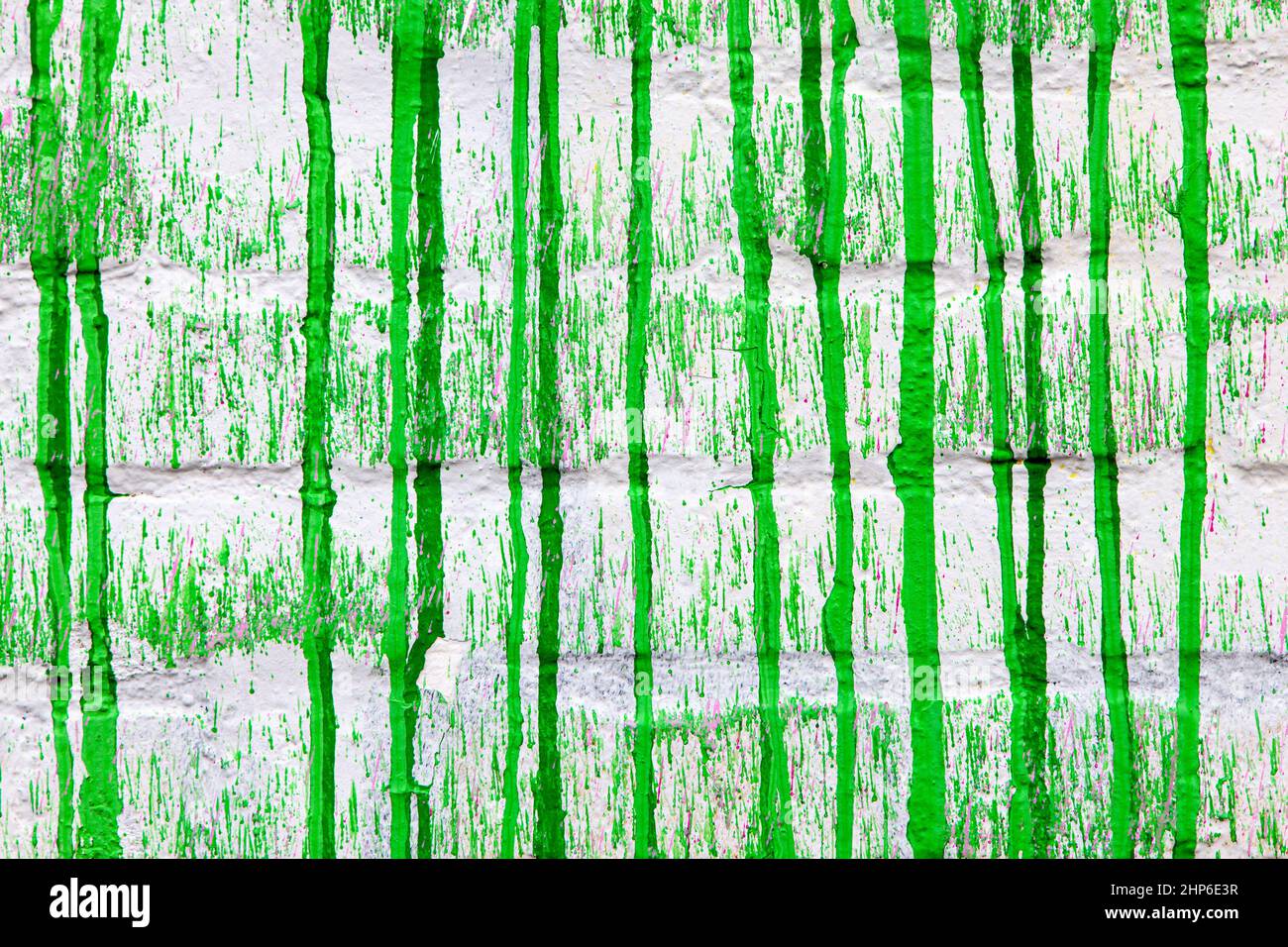 Green paint drips on a white brick wall abstract grunge color texture ...