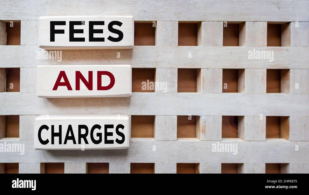 Wooden blocks word fees hi-res stock photography and images - Alamy