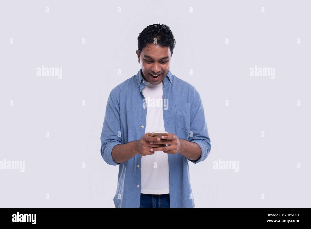 Indian Man Standing Using Phone Over Exceeded Isolated. Man Texting on ...