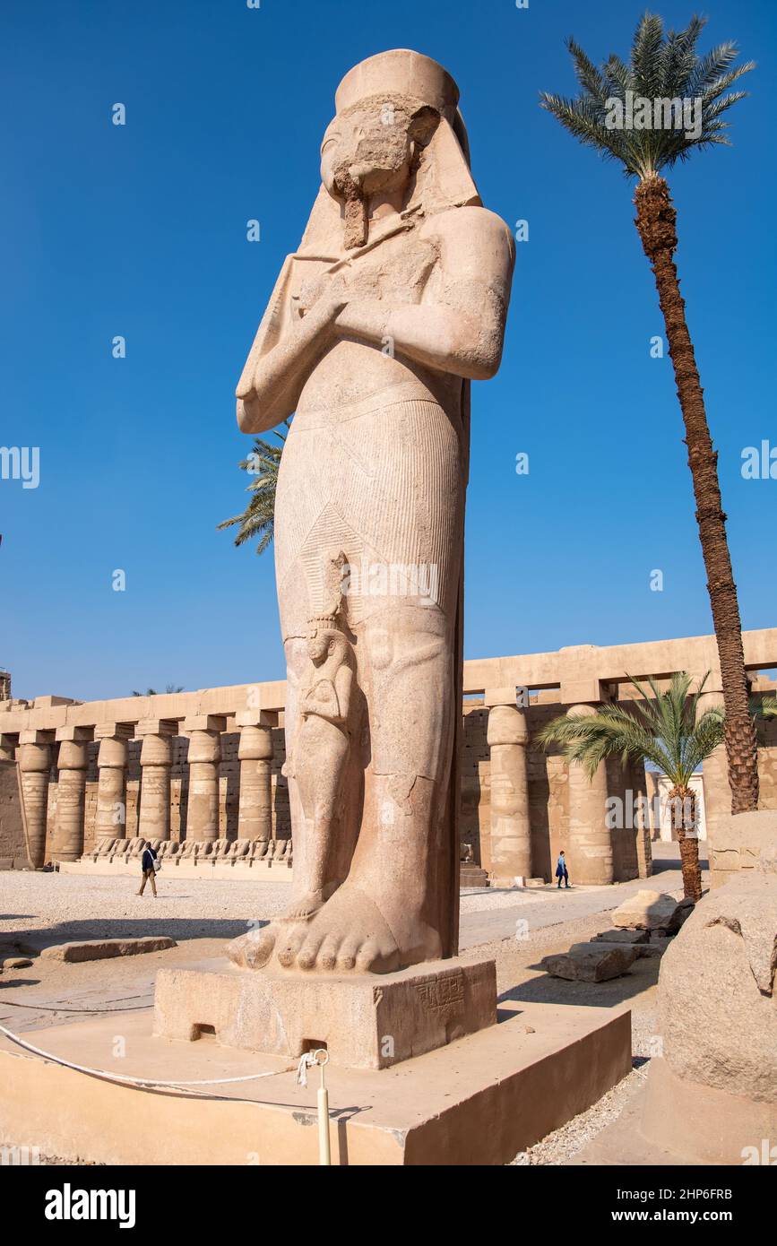 Statue of Ramesses II and his daughter Bent-Anat in the first courtyard ...
