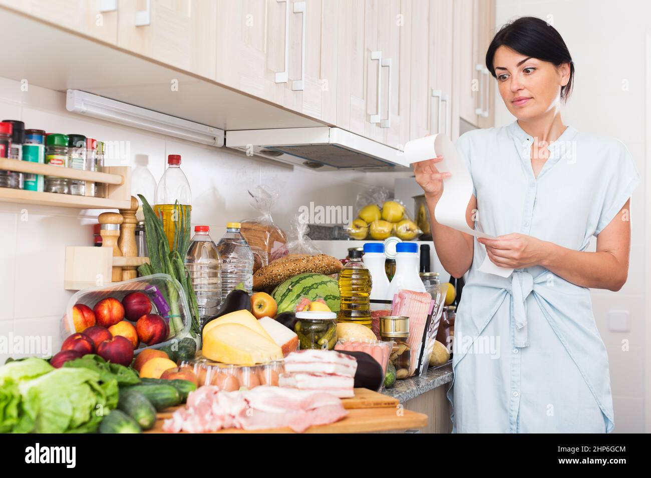 woman is checking purchases Stock Photo - Alamy woman is checking purchases Stock Photo - Alamy