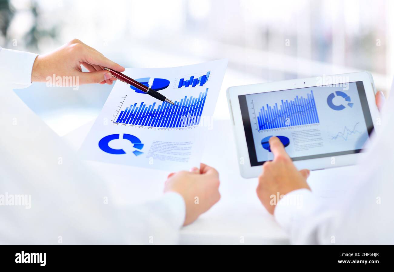 Close-up of Business people discussing a financial plan Stock Photo - Alamy