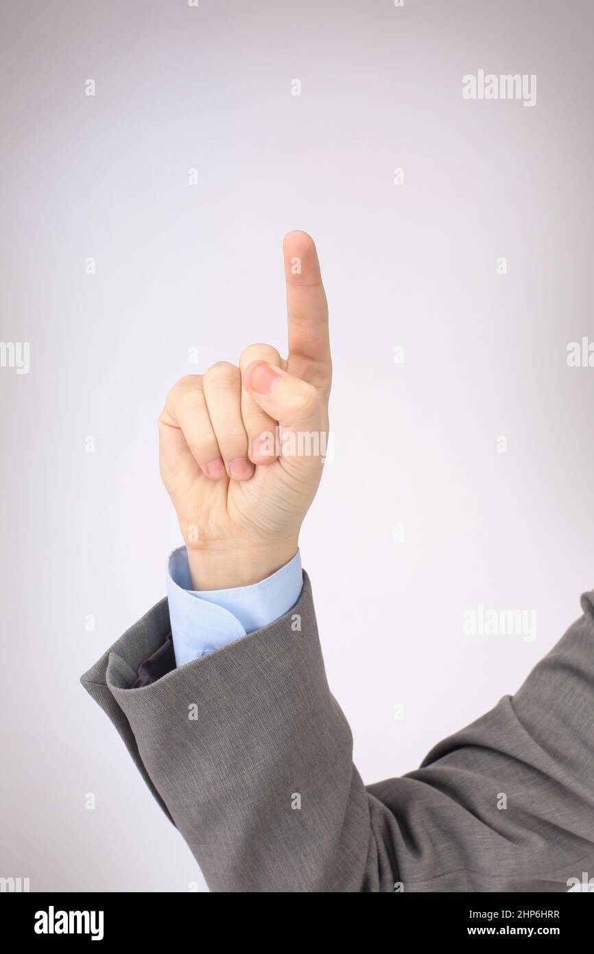 The man's hand shows a symbol Stock Photo - Alamy