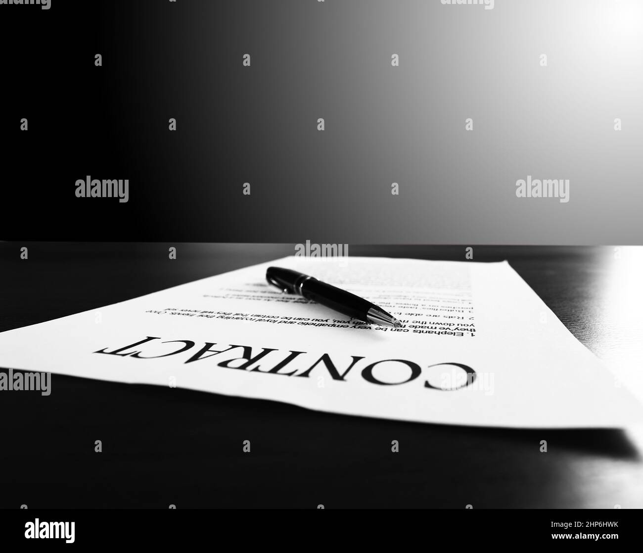 The image of a business contract on a black background with a gradient ...