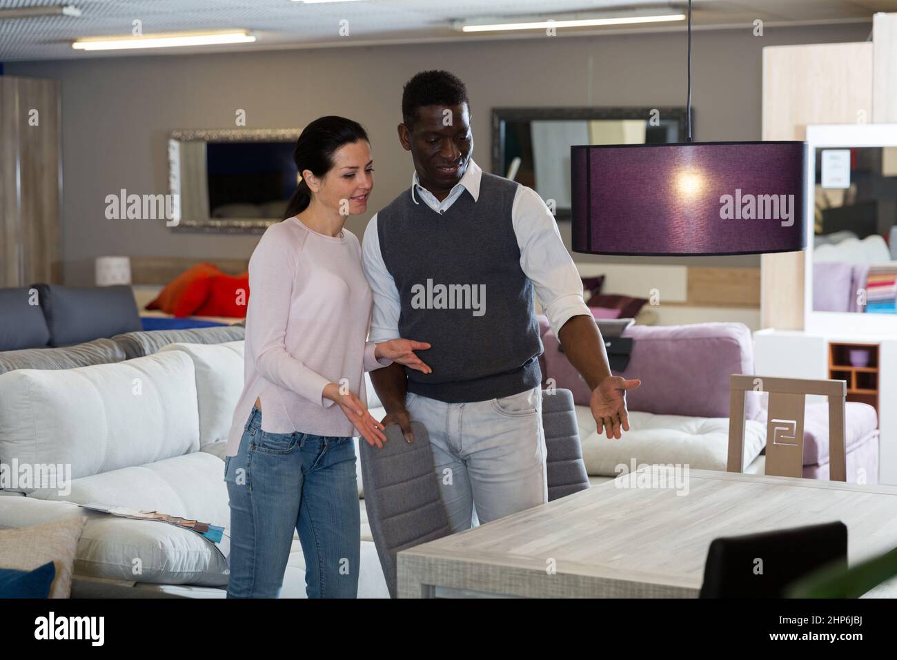 African man with his wife are choosing new table for living room Stock ...